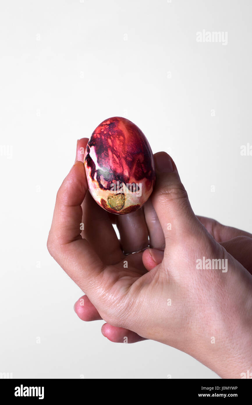 Hand holding painted egg hi-res stock photography and images - Alamy