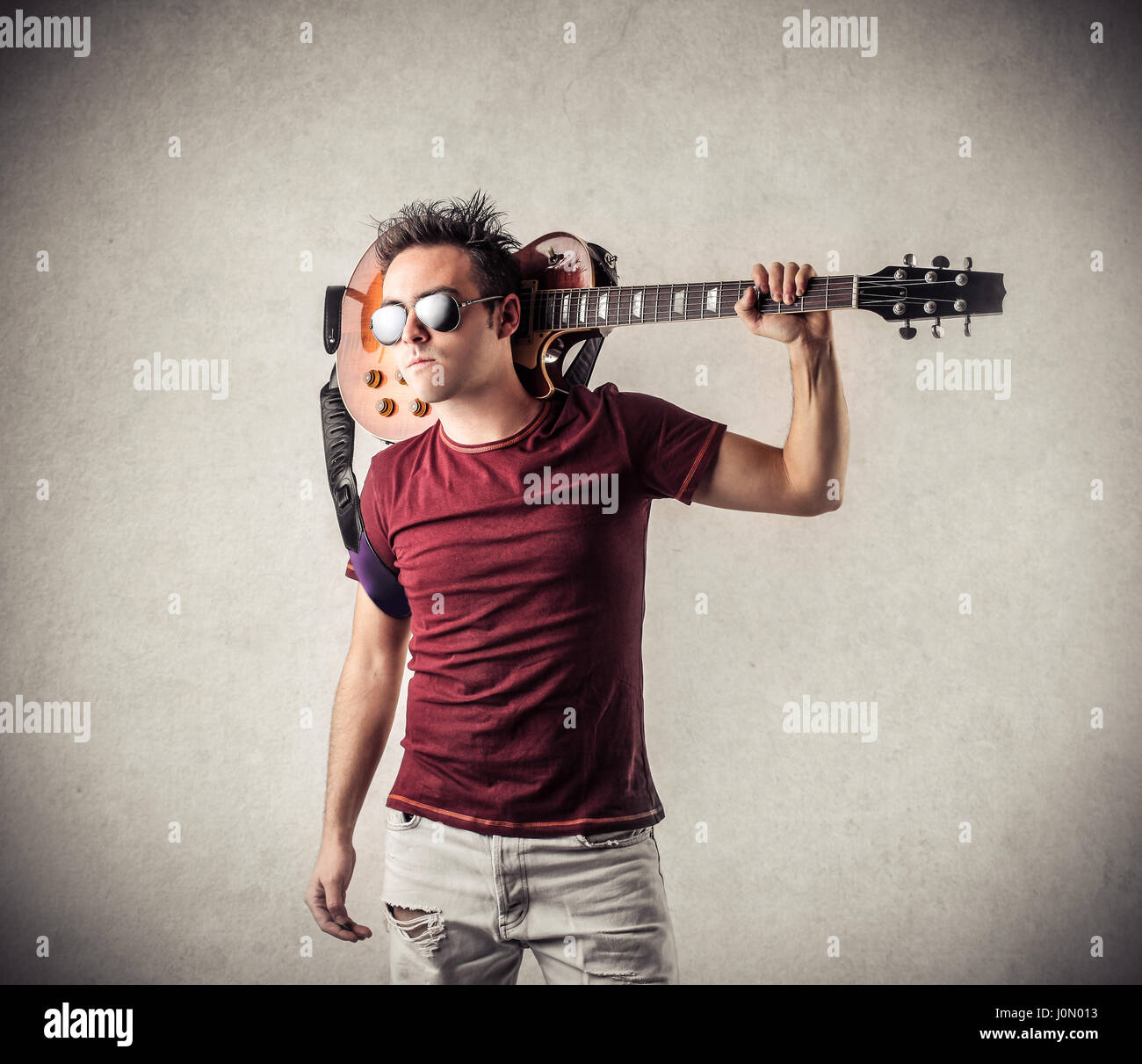 Rocker man with guitar Stock Photo - Alamy