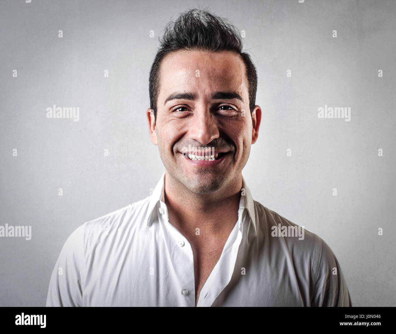 Confident man smiling Stock Photo - Alamy