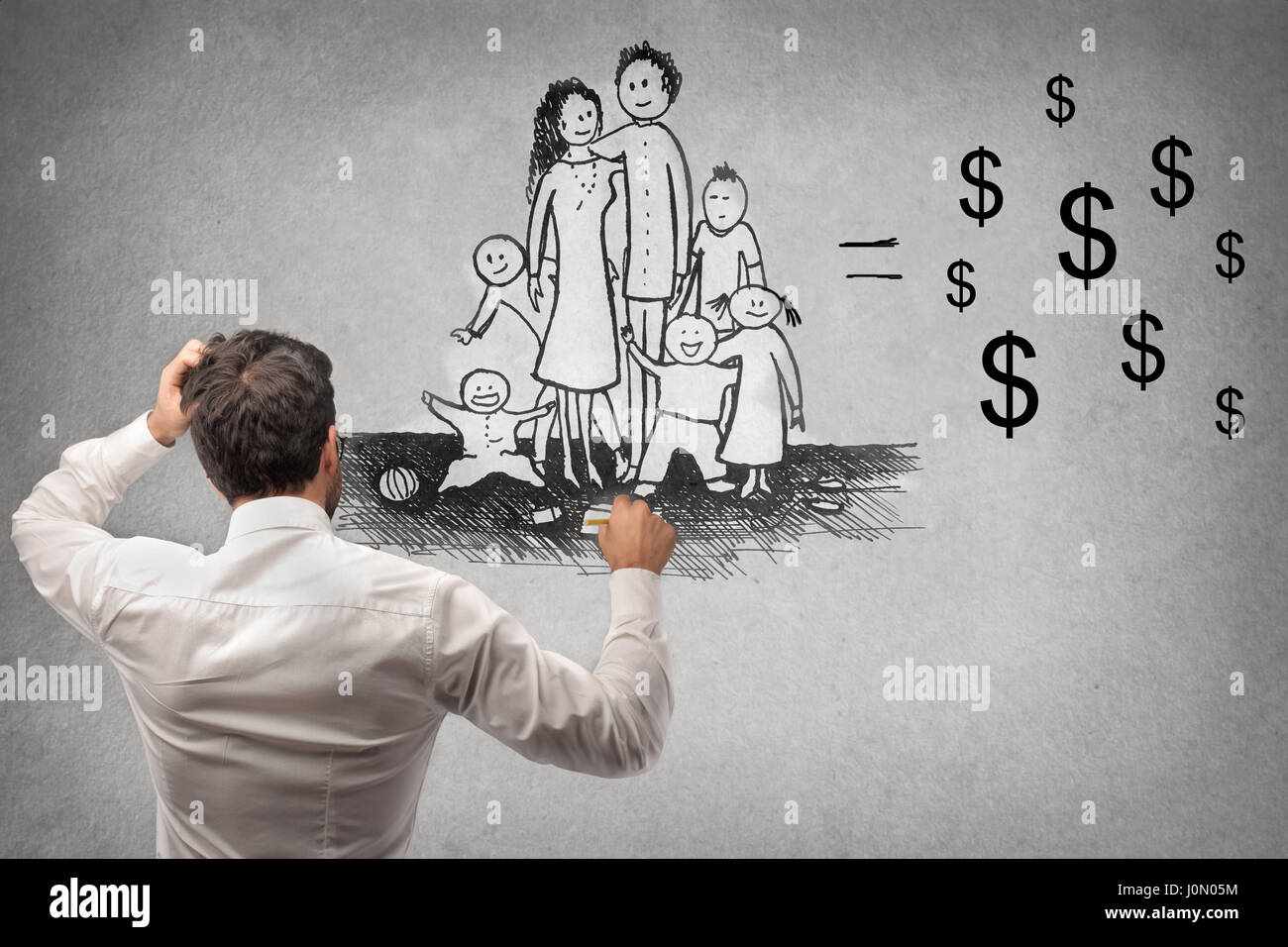 Businessman thinking about managing a family Stock Photo - Alamy
