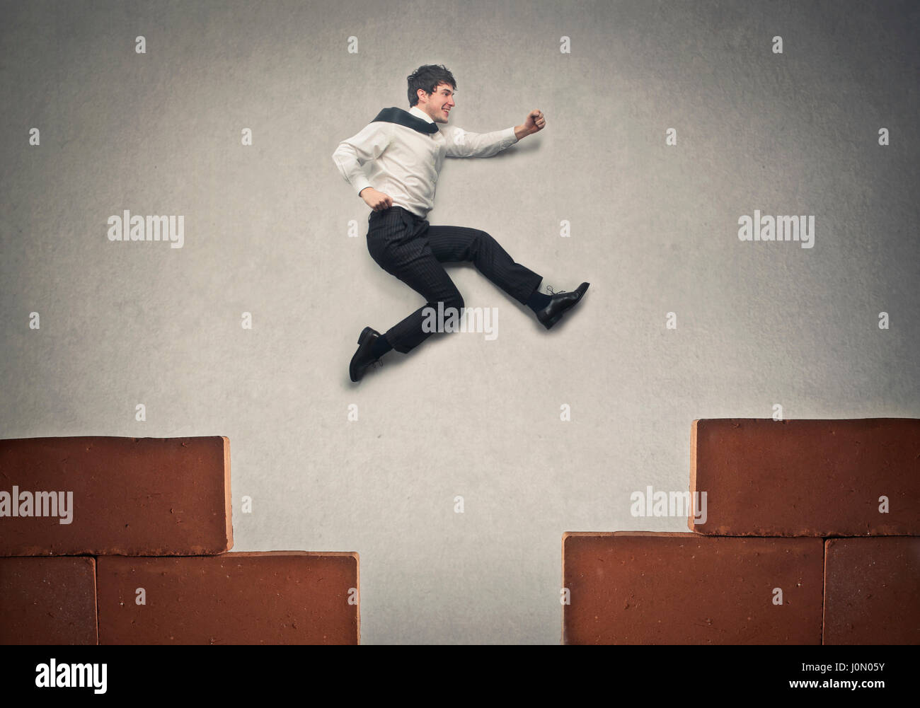 Man jumping over wall hi-res stock photography and images - Alamy