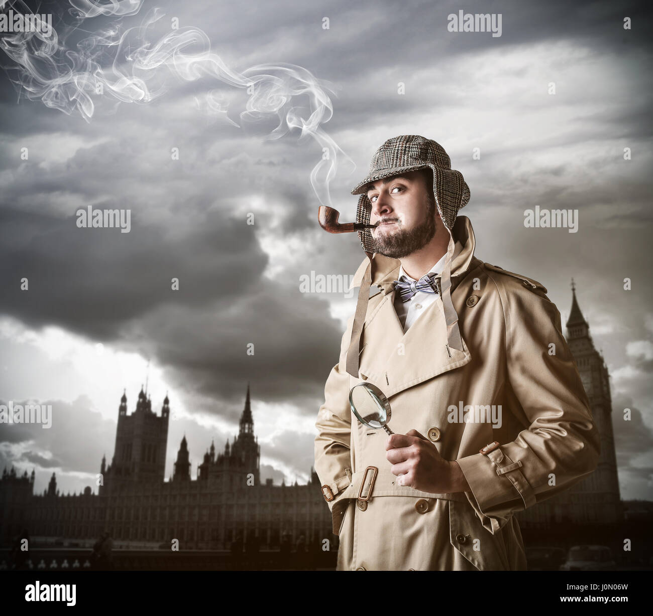 Investigator man smoking on pipe outside Stock Photo - Alamy