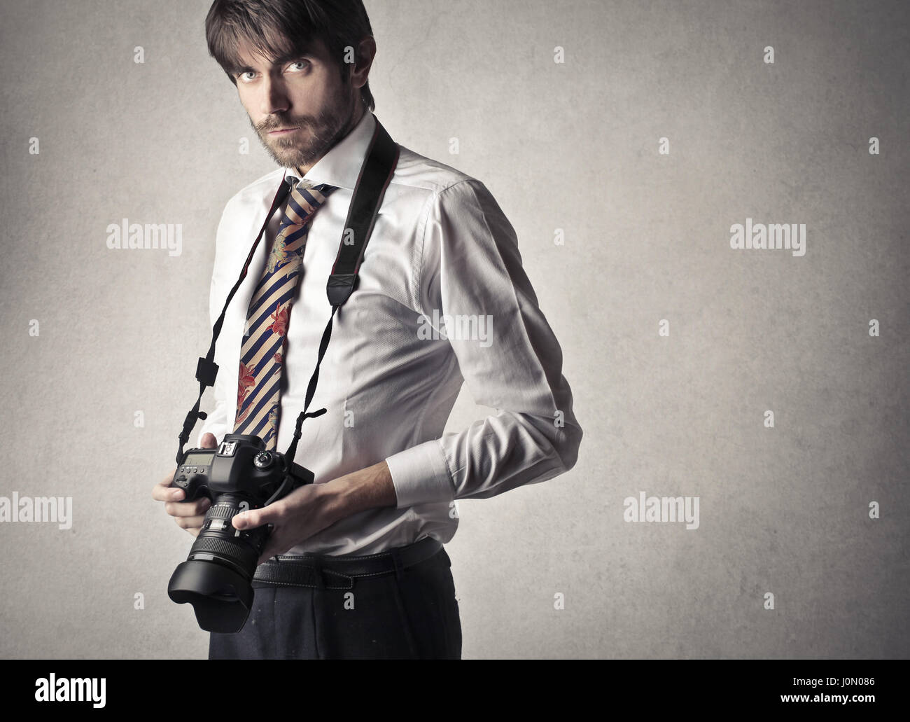 Photographer man with camera Stock Photo - Alamy