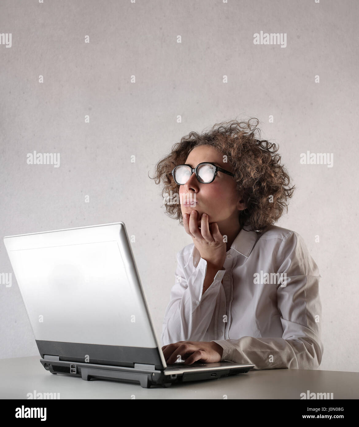 Woman working in front of laptop Stock Photo - Alamy