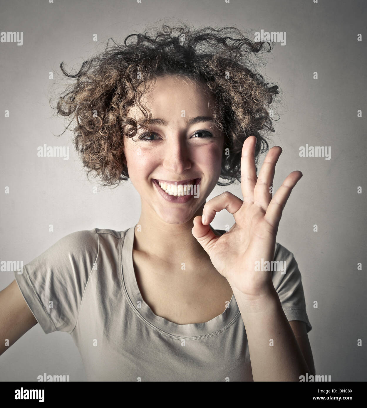 Woman showing perfect sign Stock Photo - Alamy
