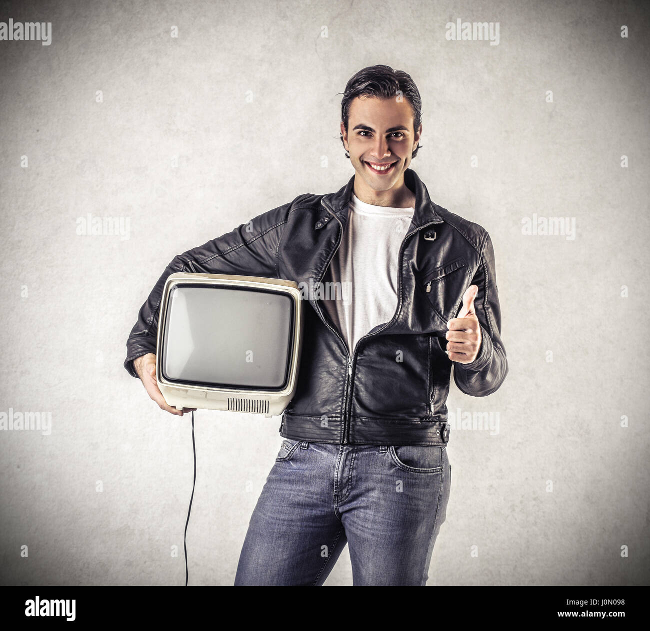 Man holding old TV Stock Photo - Alamy