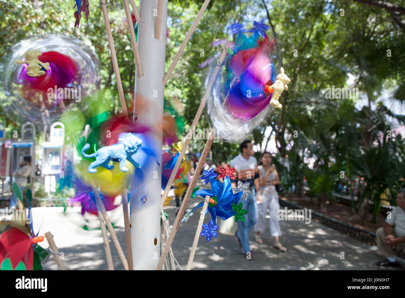 pinwheels blowing in wind in park Stock Photo - Alamy