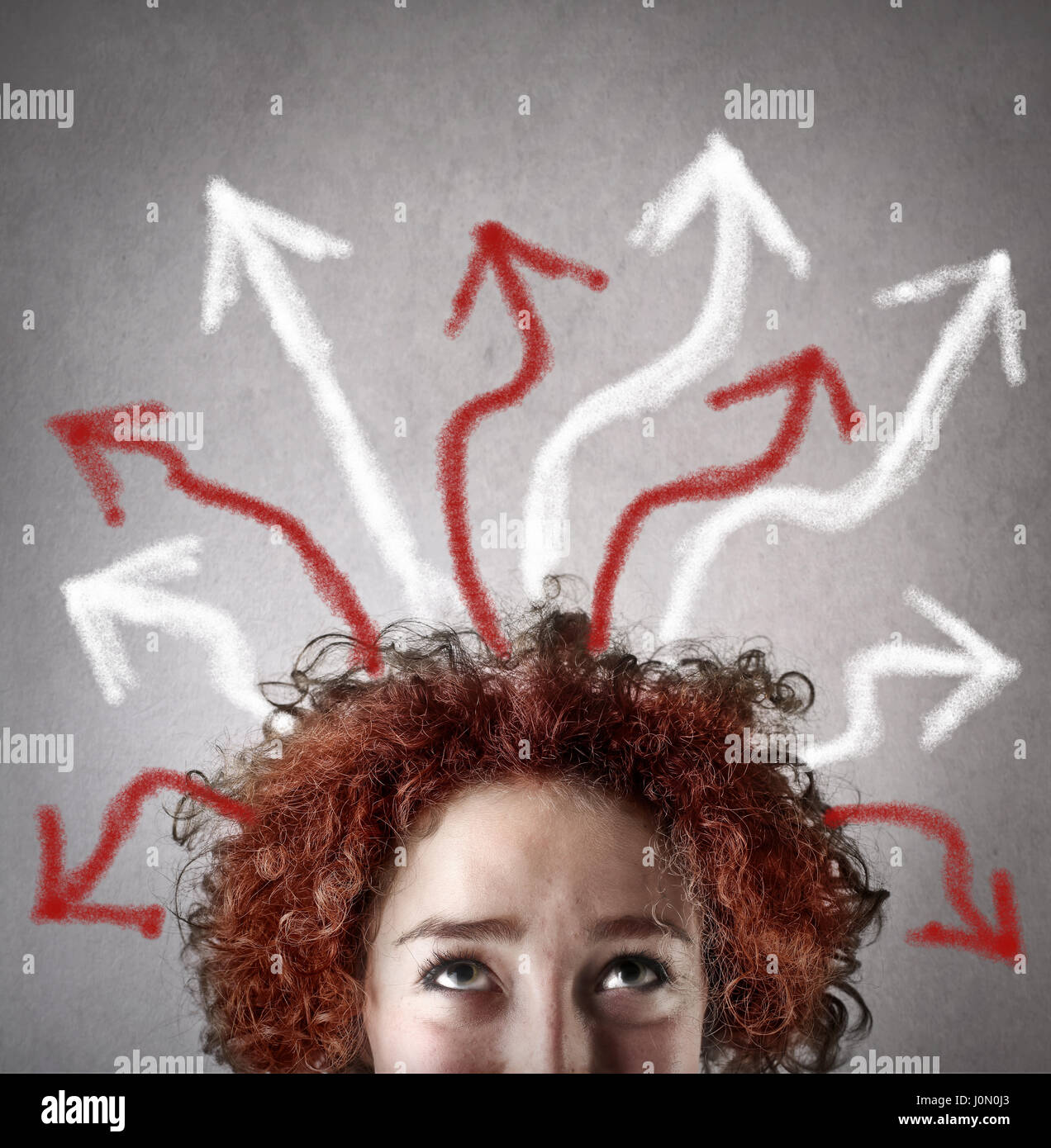 Woman with arrows coming out of her head Stock Photo - Alamy