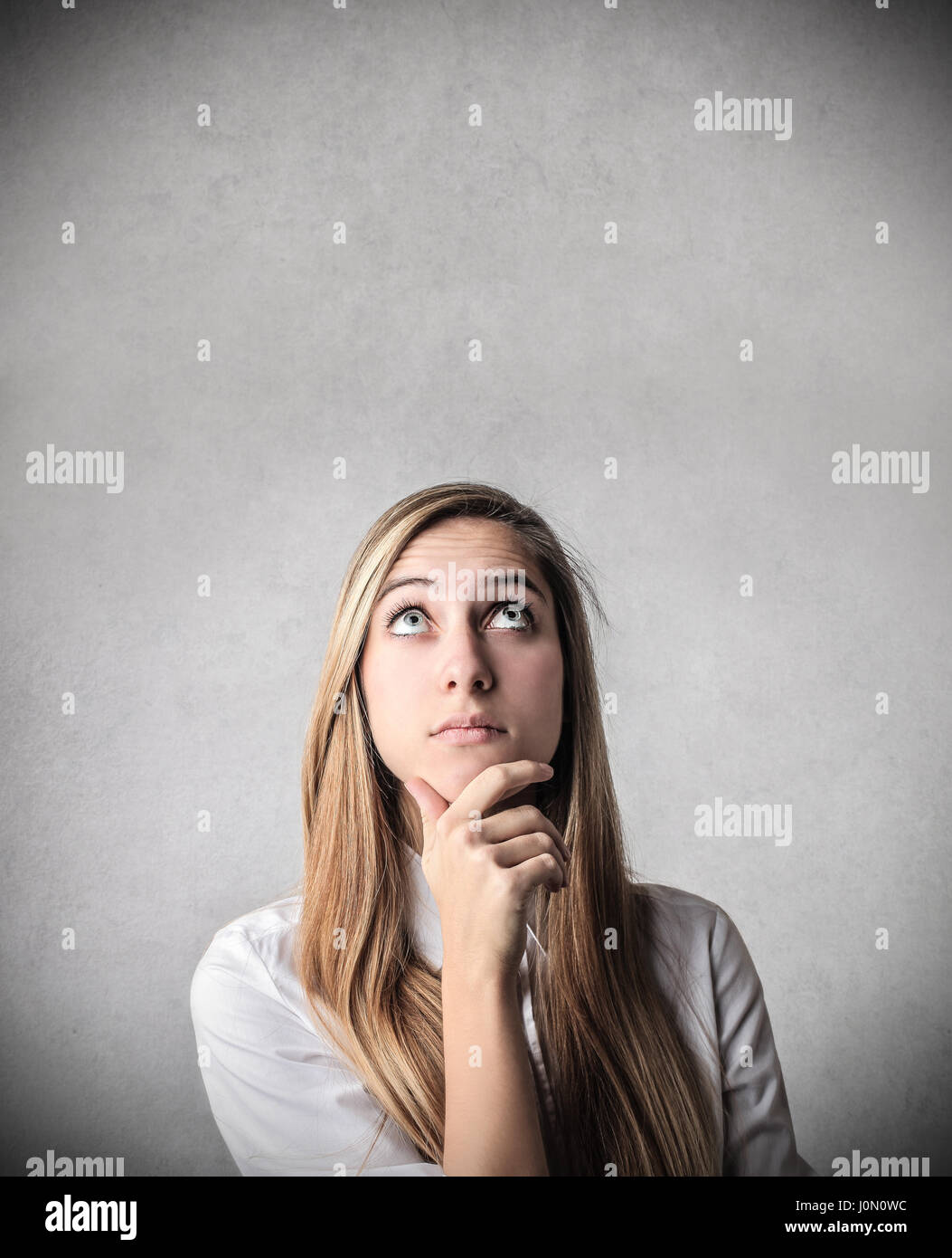 Young woman thinking inside Stock Photo - Alamy