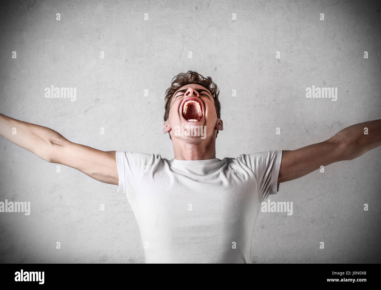 Man yelling inside Stock Photo - Alamy
