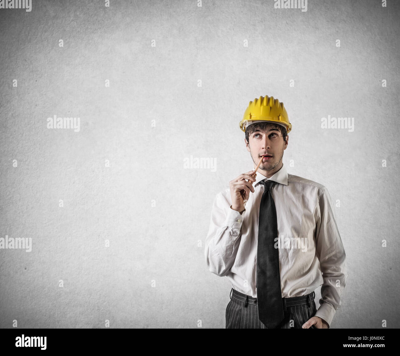 Construction worker thinking Stock Photo - Alamy Construction worker thinking Stock Photo - Alamy