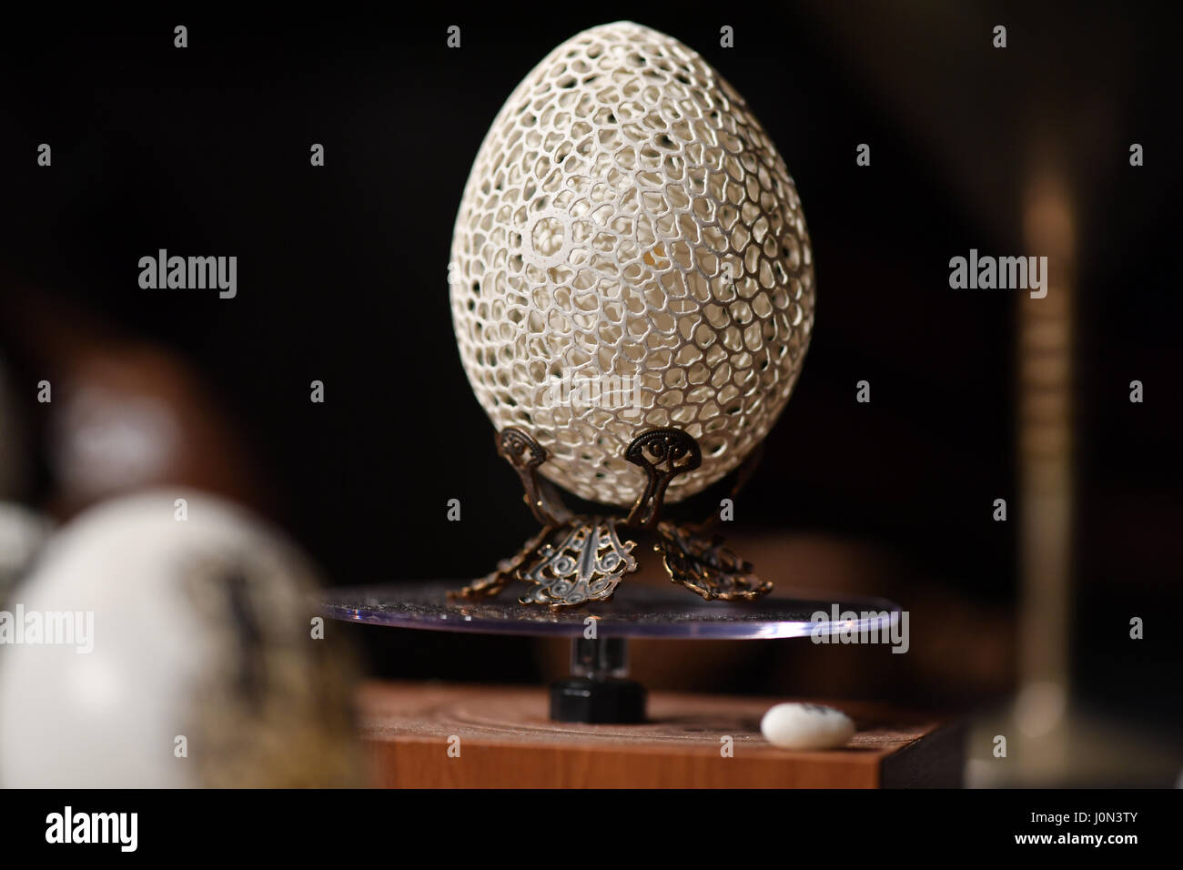 An artfully punctured Easter egg by artist Herbert Kober is on display ...