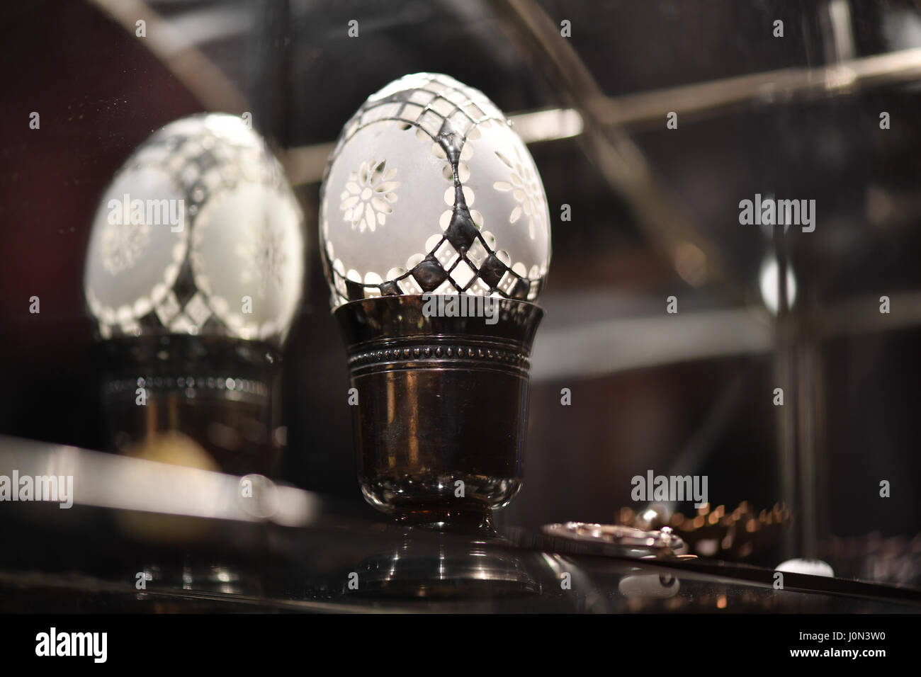 An artfully punctured Easter egg by artist Herbert Kober is on display ...