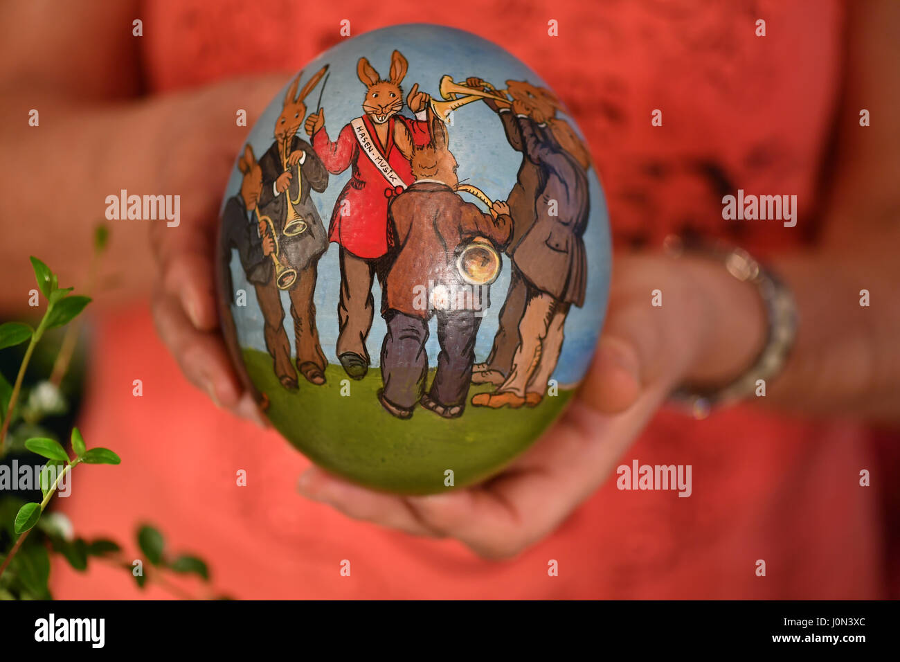 Artist Rita Grammel holds an artfully decorated and painted Easter egg ...