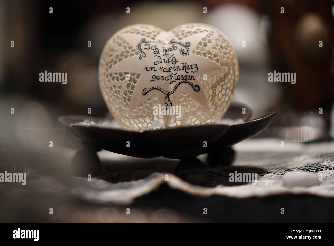 An artfully punctured Easter egg by artist Herbert Kober is on display ...