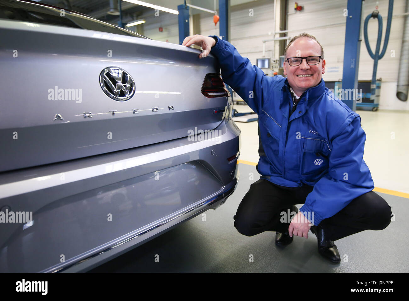 Manager of the Emden Volkswagen factory, Andreas Dick, crouching on the ...