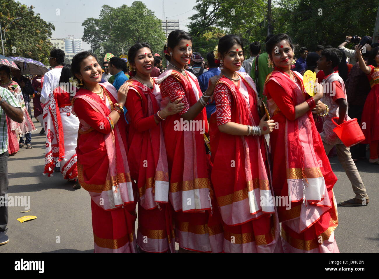 Bangladeshi people participate in a parade to celebrate the first day ...