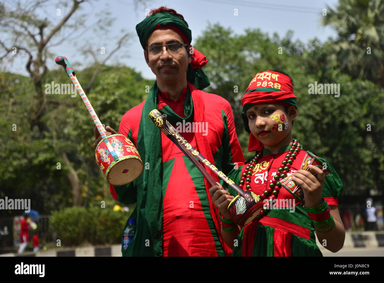 Bangladeshi people participate in a parade to celebrate the first day ...