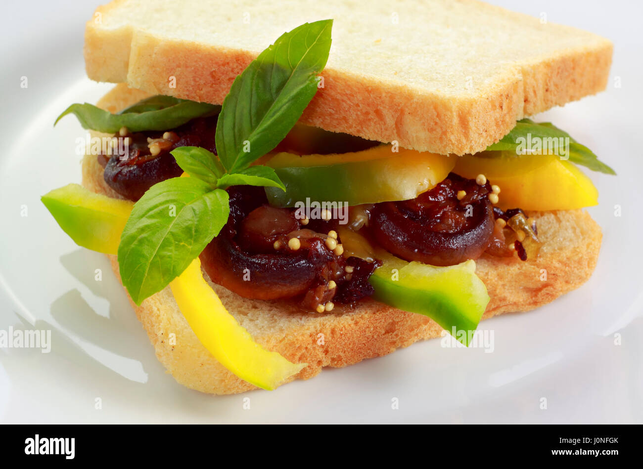 Sandwich with fried button mushroom, sweet yellow-green pepper and ...