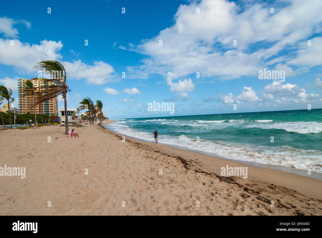 Ft. Lauderdale Beach Florida USA windy early day rough seas palm trees ...