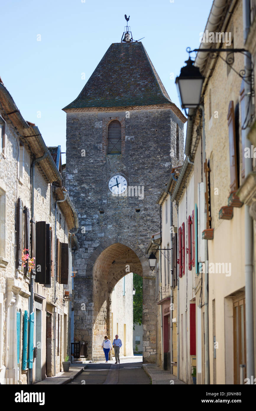 Tourists by 13th Century medieval gateway clock tower in ancient ...