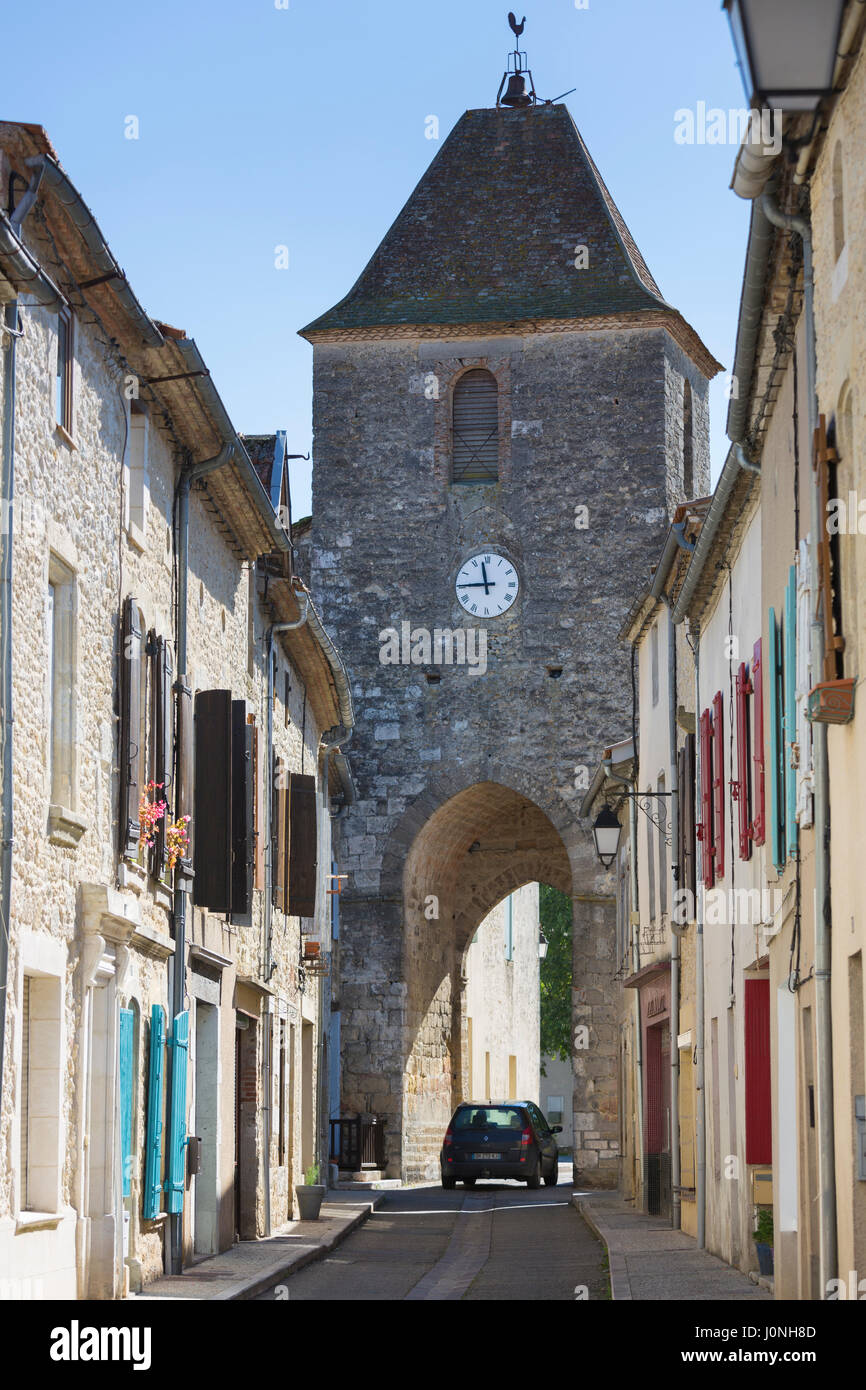 Small car passes through 13th Century medieval gateway clock tower in ...