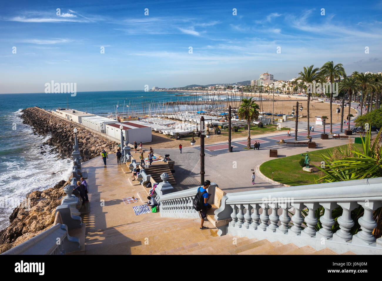Resort town of Sitges in Spain, stairs to the beach and promenade at ...