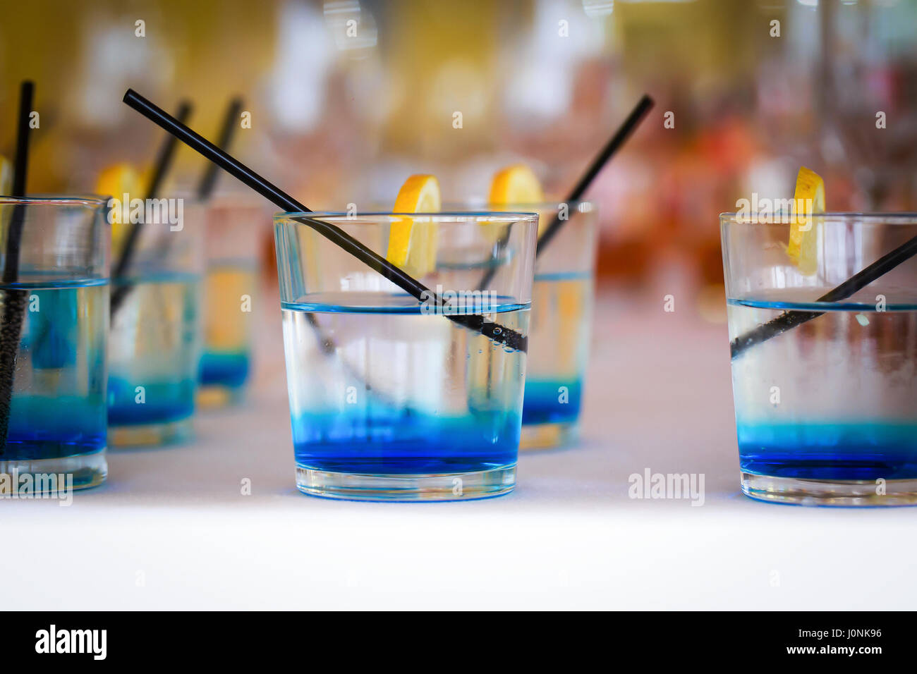 Row of blue shot drinks for nice party Stock Photo - Alamy