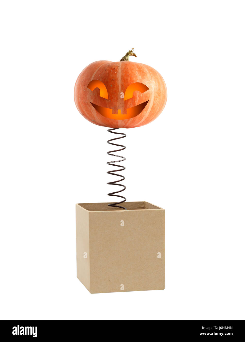 Smiling pumpkin head on metal spring jumping from box Stock Photo - Alamy