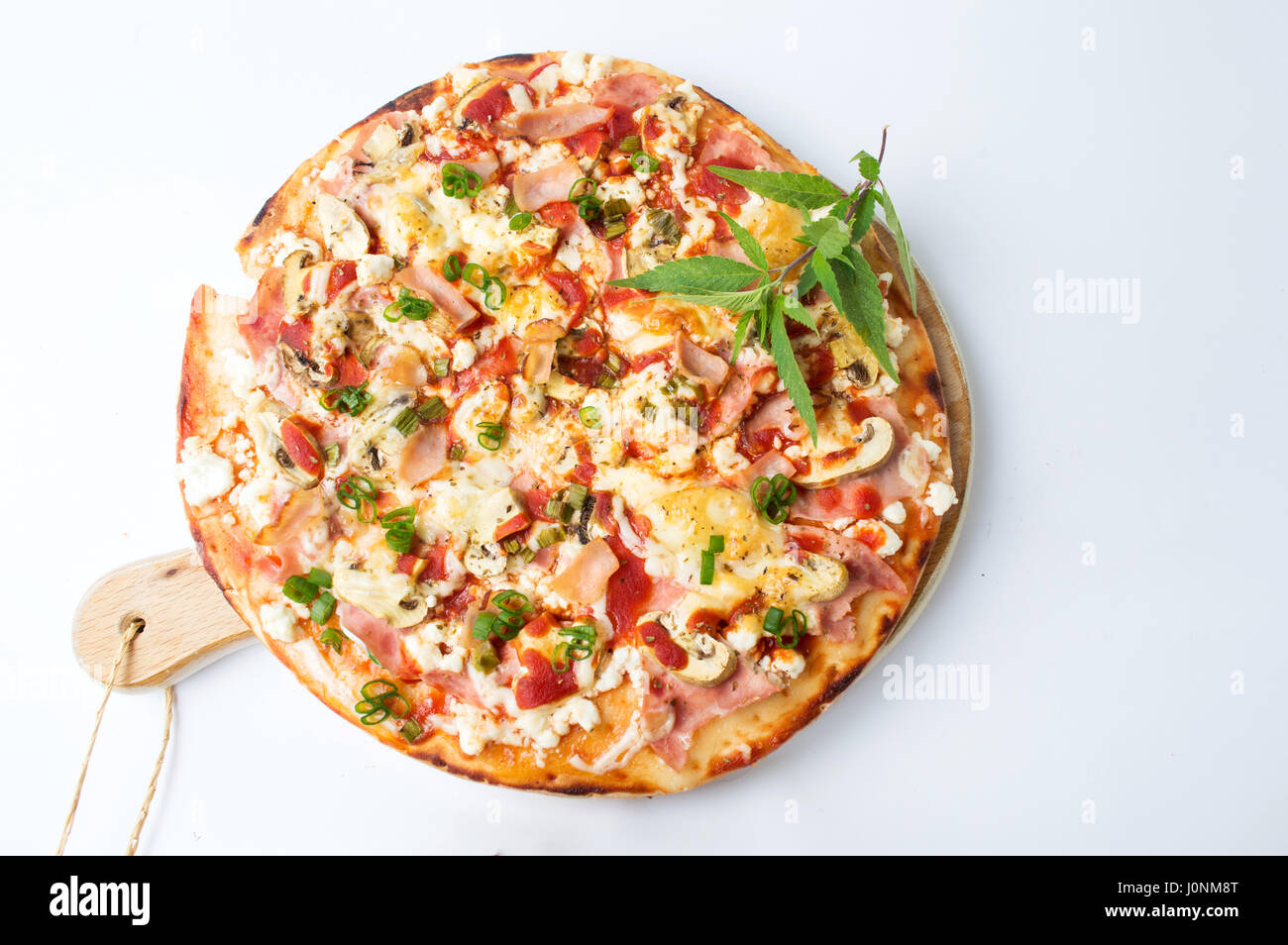 Happy pizza with marijuana leaves on a tray Stock Photo - Alamy
