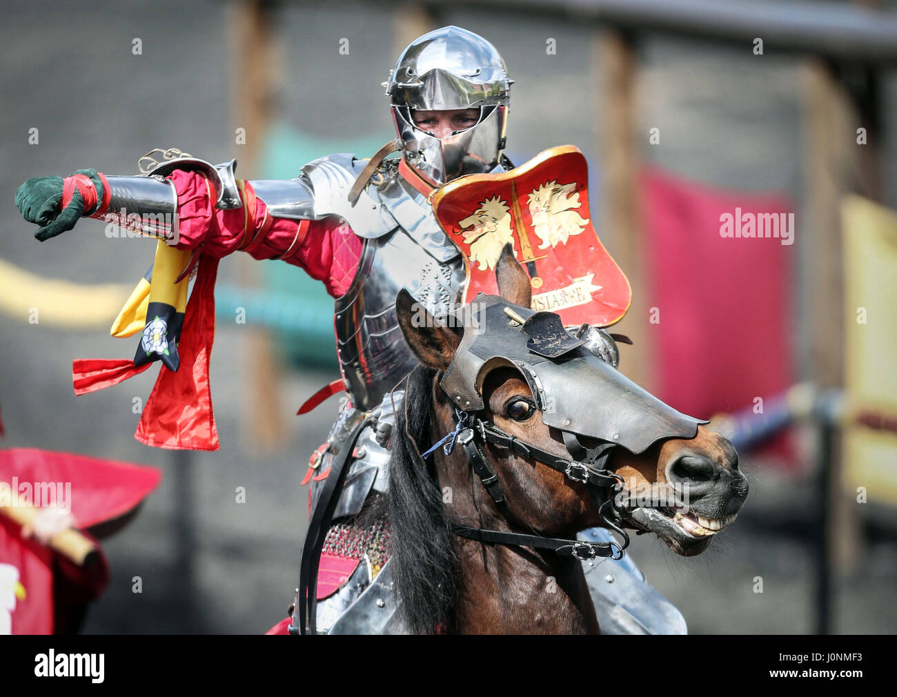 A man dressed as a knight takes part in a jousting competition during ...
