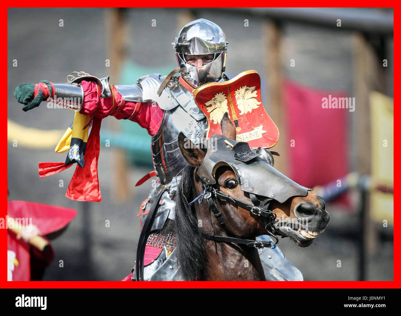 PABEST A man dressed as a knight takes part in a jousting competition ...