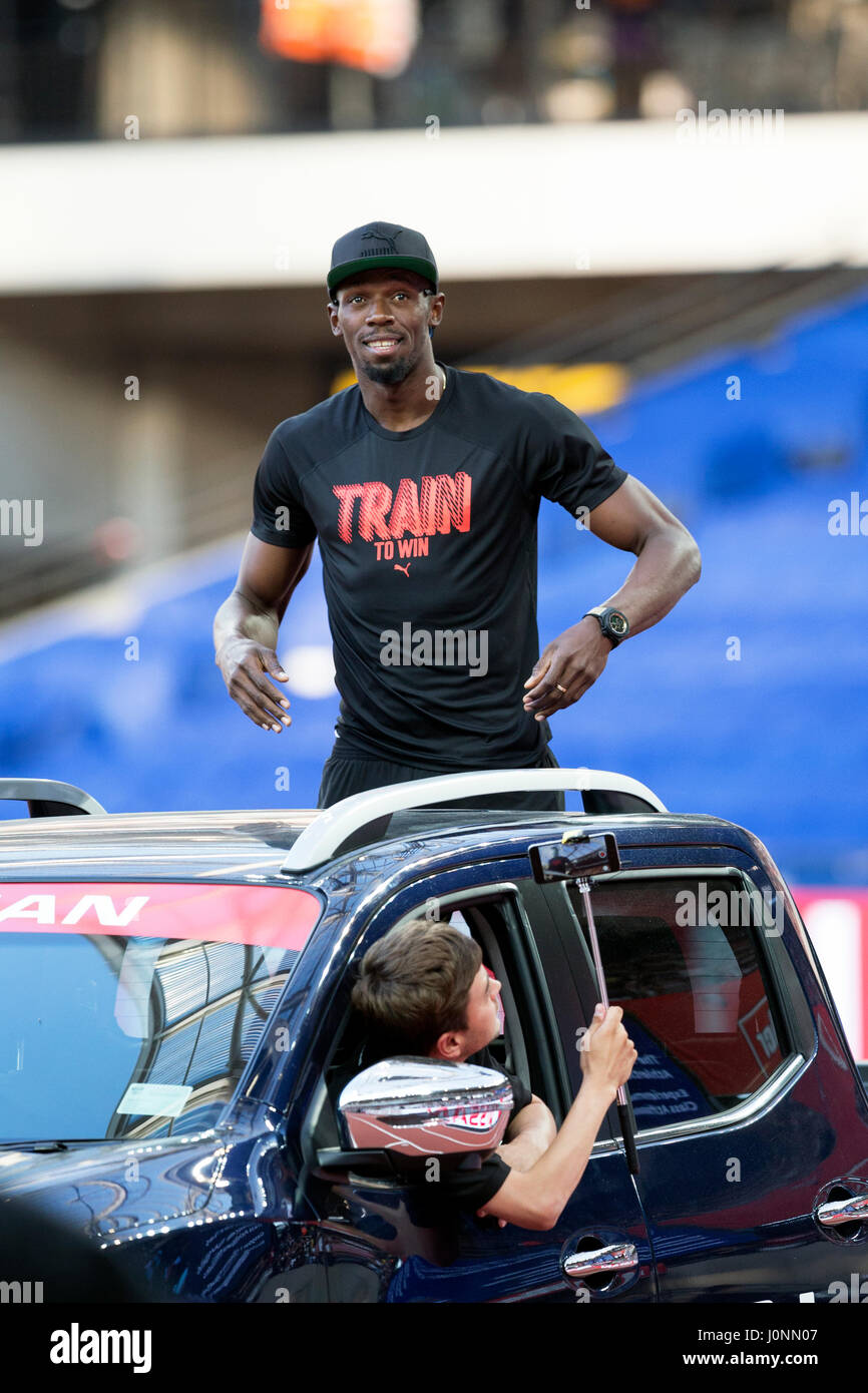 Usain Bolt on a parade lap in a Nissan Navara at the London UK. IAAF ...
