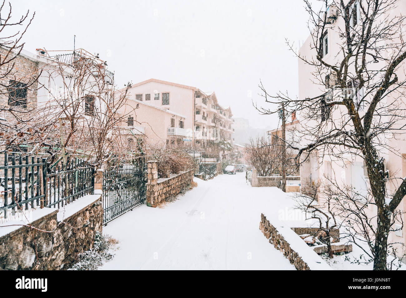 Street in the snow. A rare phenomenon - snow on the coast in Budva ...
