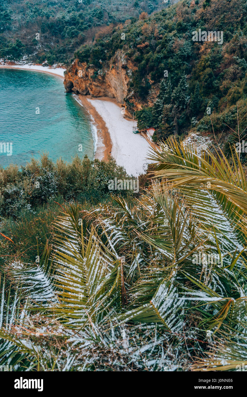 Snow on the beach. Snow-covered beach of the sea. Anomaly in Montenegro ...