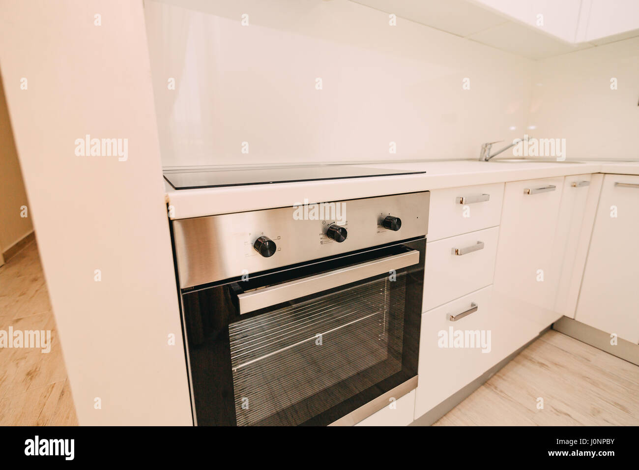 The oven in the kitchen. Stove with oven. The kitchen in the apartment ...