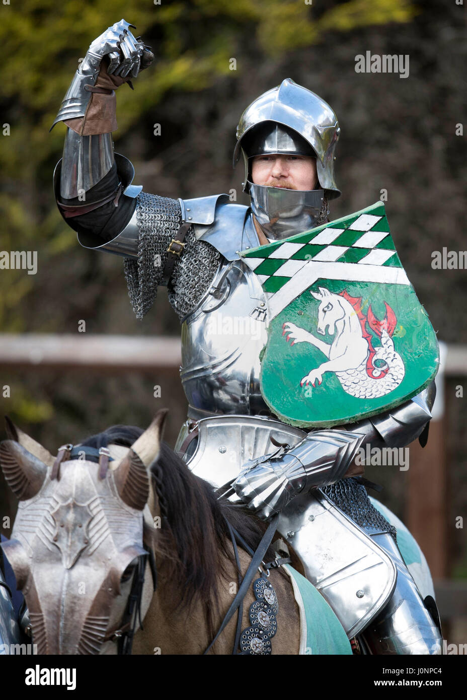A man dressed as knights takes part in a jousting competition during ...