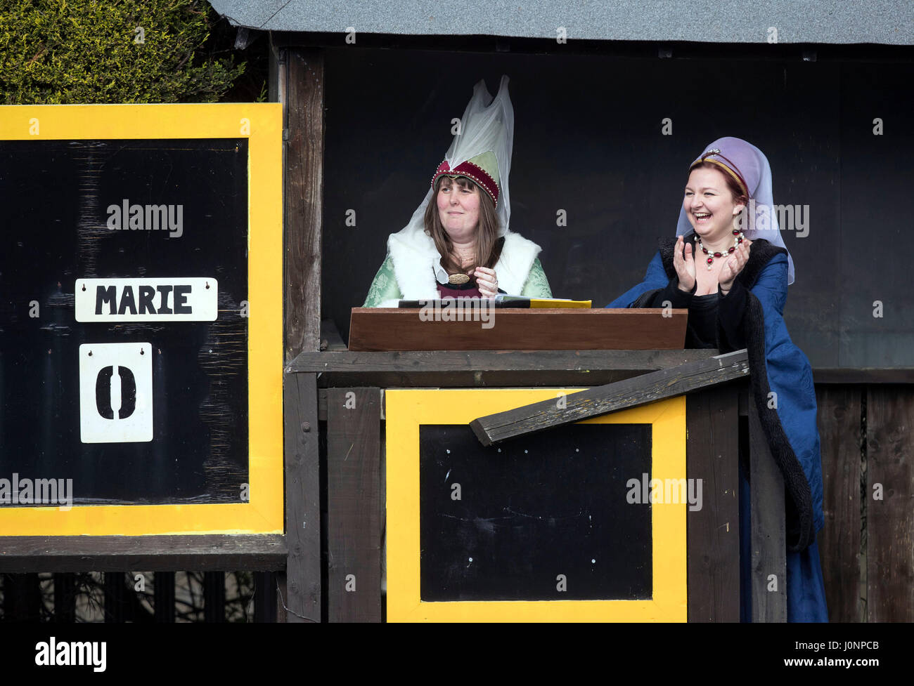 Woman in medieval dress watch a jousting competition during the Easter ...