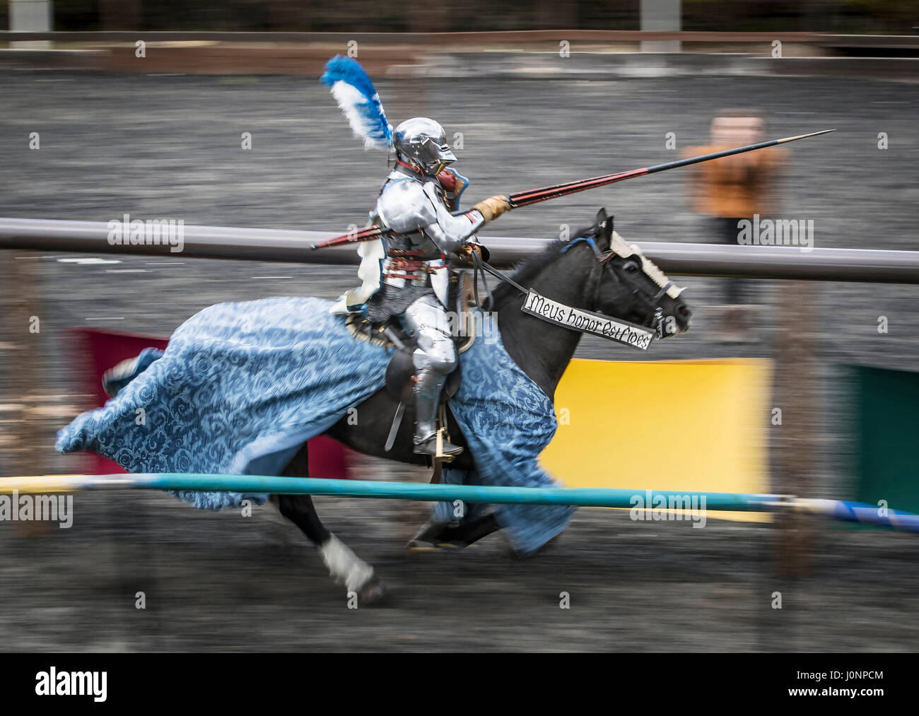 A man dressed as knights takes part in a jousting competition during ...