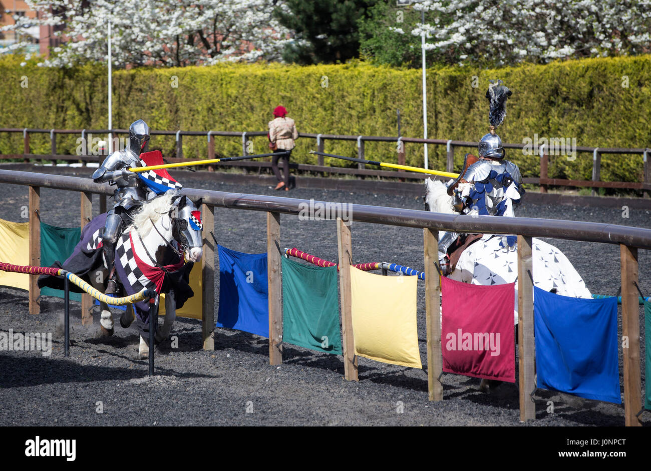 Men dressed as knights takes part in a jousting competition during the ...