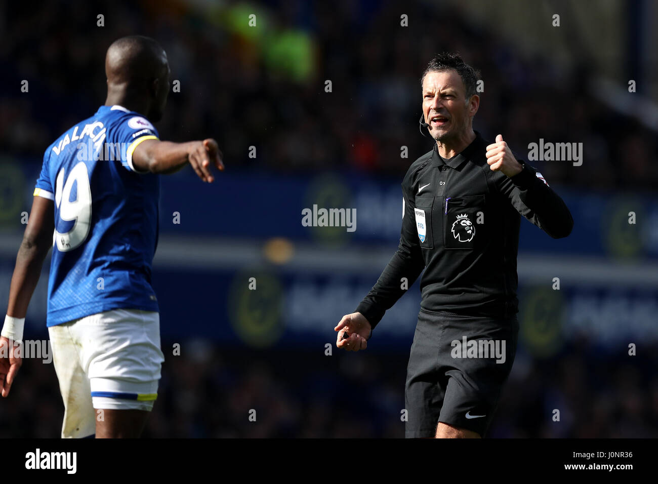 Referee Mark Clattenburg (right) lectures Everton's Enner Valencia ...