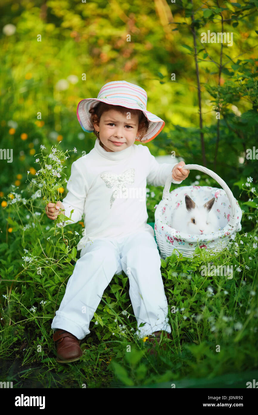 cute little girl with white rabbit Stock Photo - Alamy