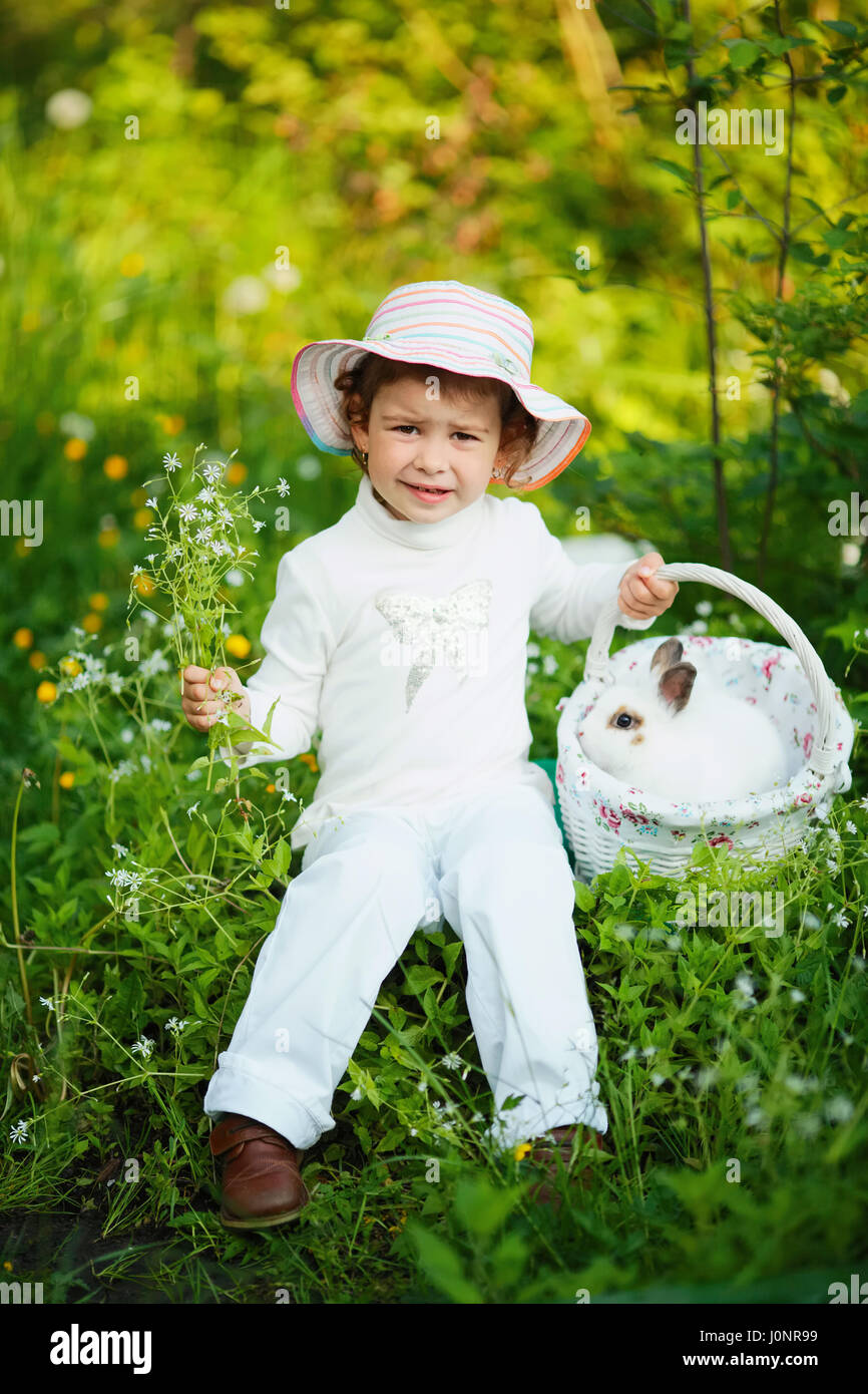 cute little girl with white rabbit Stock Photo - Alamy
