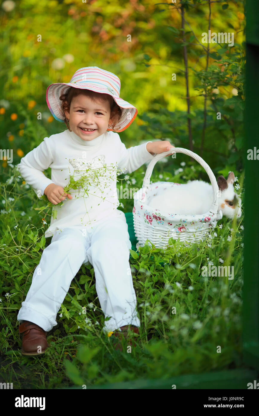 cute little girl with white rabbit Stock Photo - Alamy