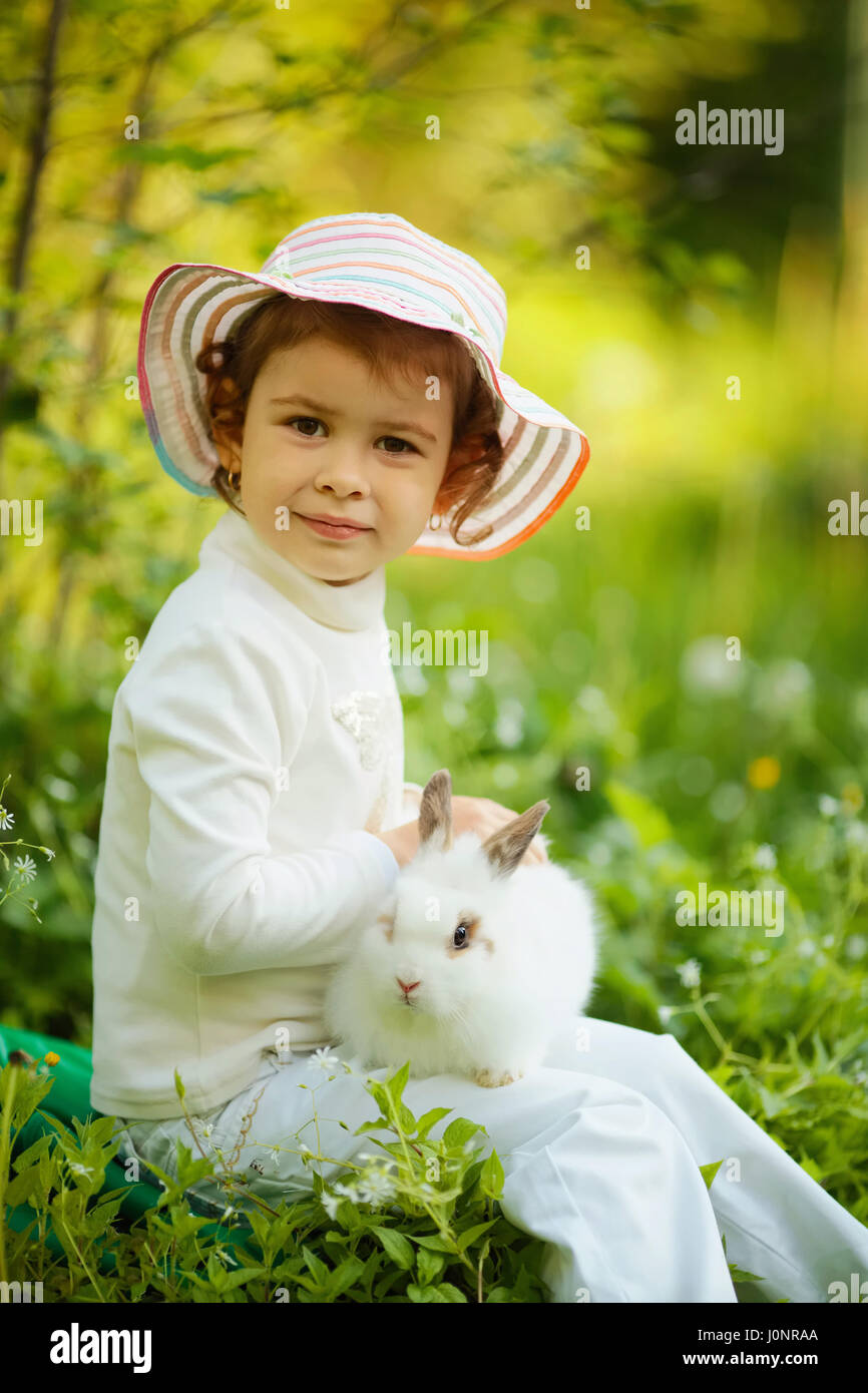 cute little girl with white rabbit Stock Photo - Alamy