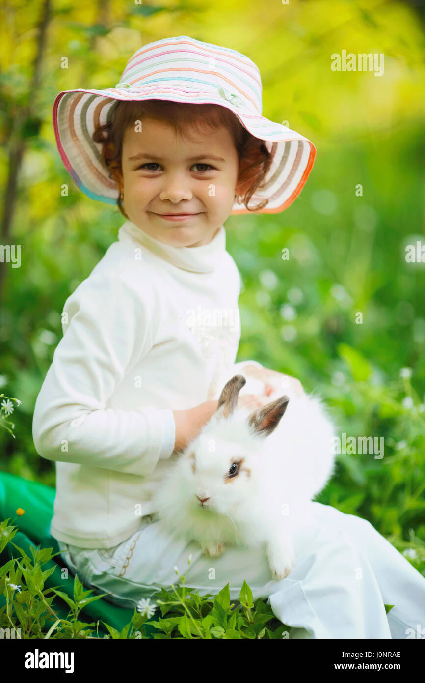 cute little girl with white rabbit Stock Photo - Alamy