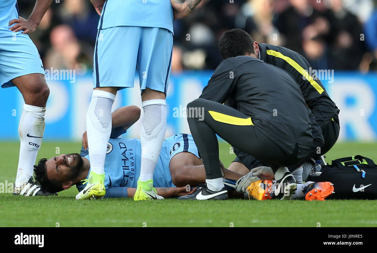 Manchester City's Sergio Aguero receives treatment to a injury during ...