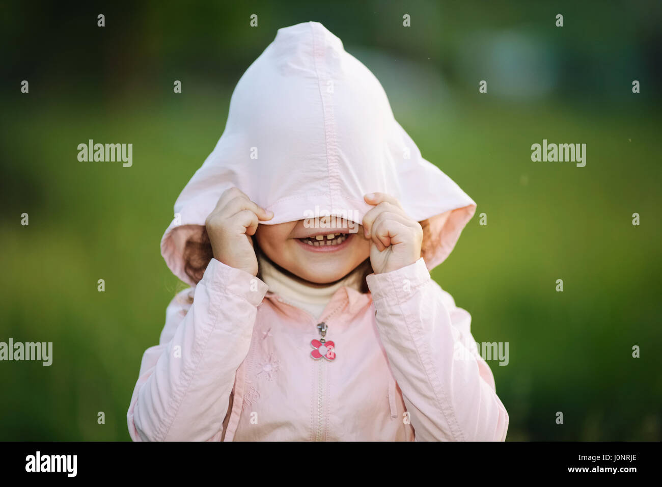 cute little girl hood in summer park Stock Photo - Alamy