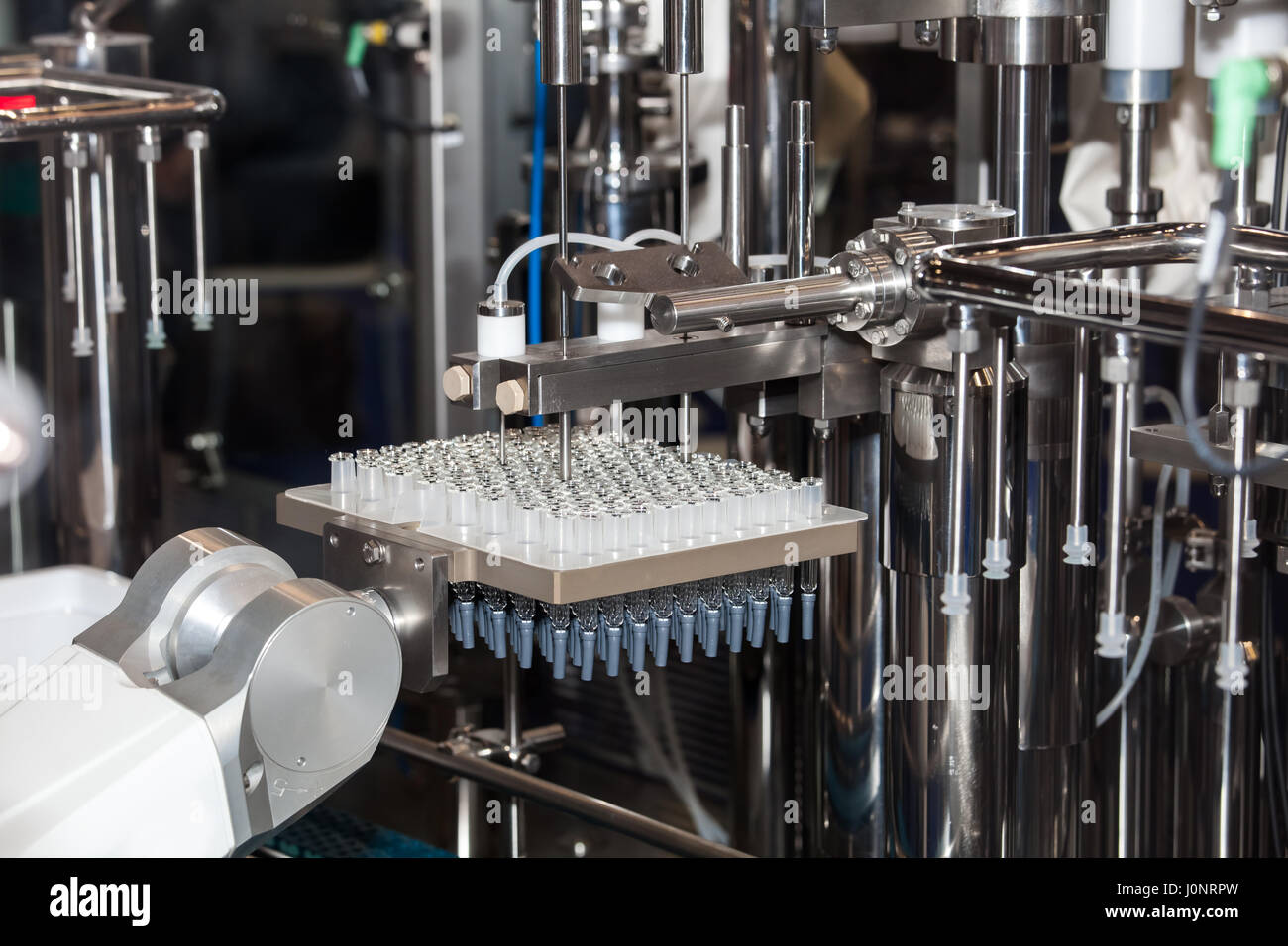 Sterile bottles and ampoules on the dispensing line, medical laboratory ...