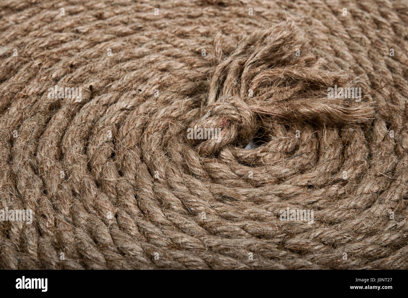 Rough, natural hemp rope, twisted by a spiral Stock Photo - Alamy